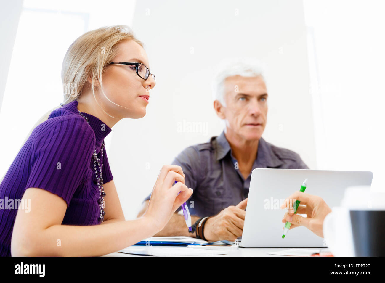 Business team working together in office Stock Photo - Alamy