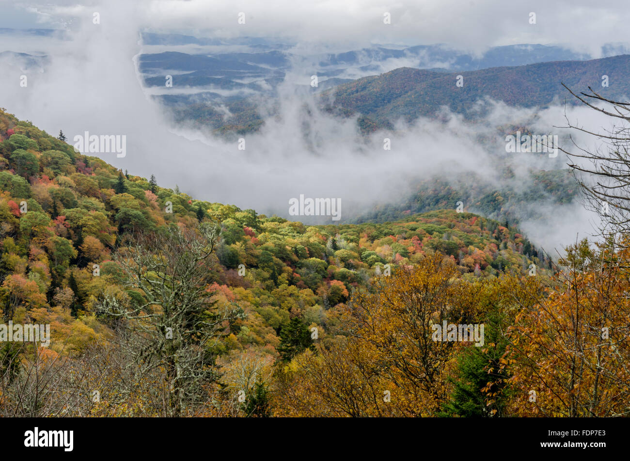 Fog drops into mountains in early fall along the Blue Ridge Parkway ...
