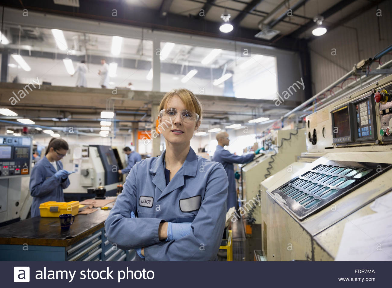 Portrait confident worker in textile factory Stock Photo - Alamy