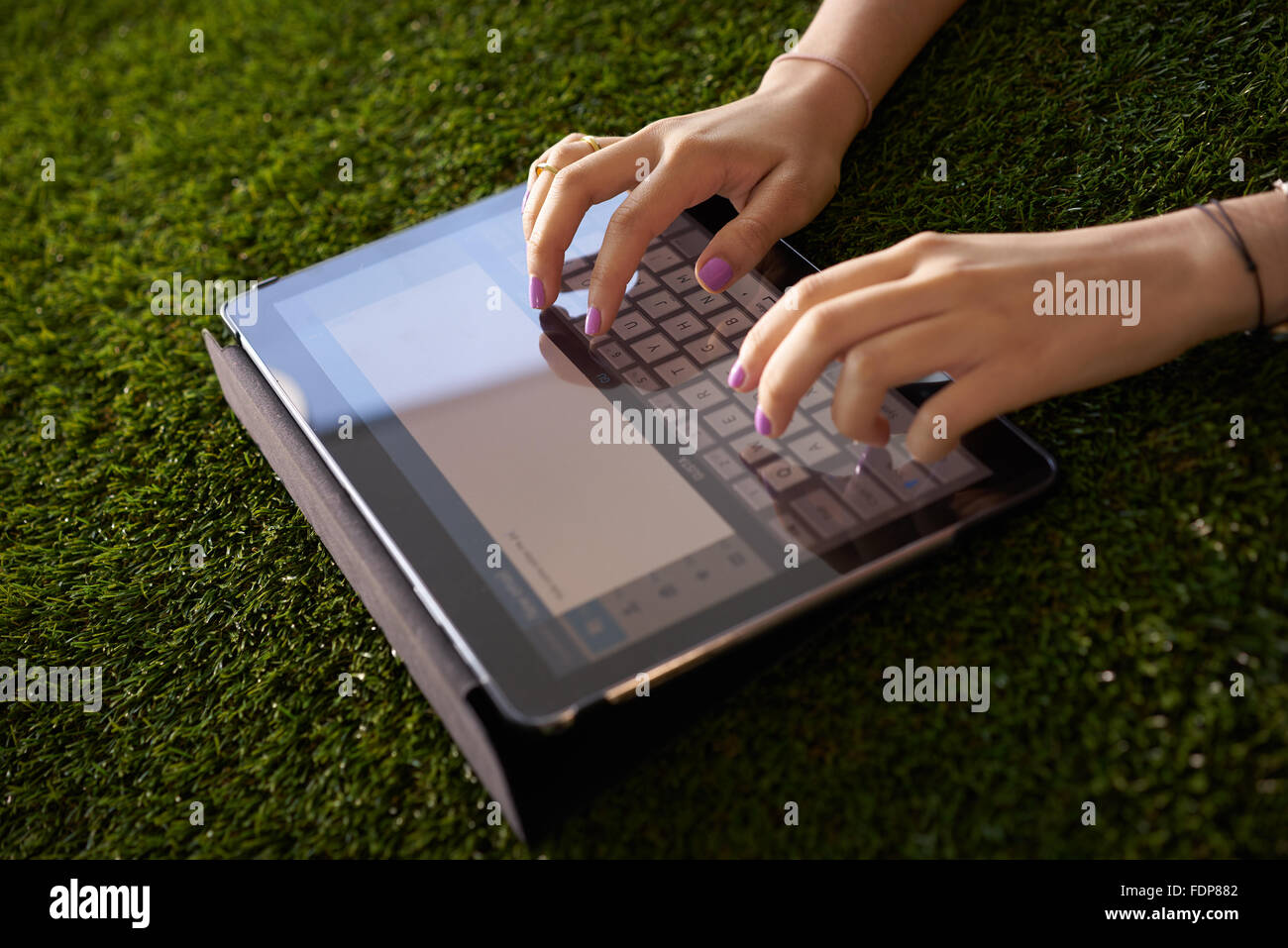 Hand tablet screen typing hi-res stock photography and images - Alamy