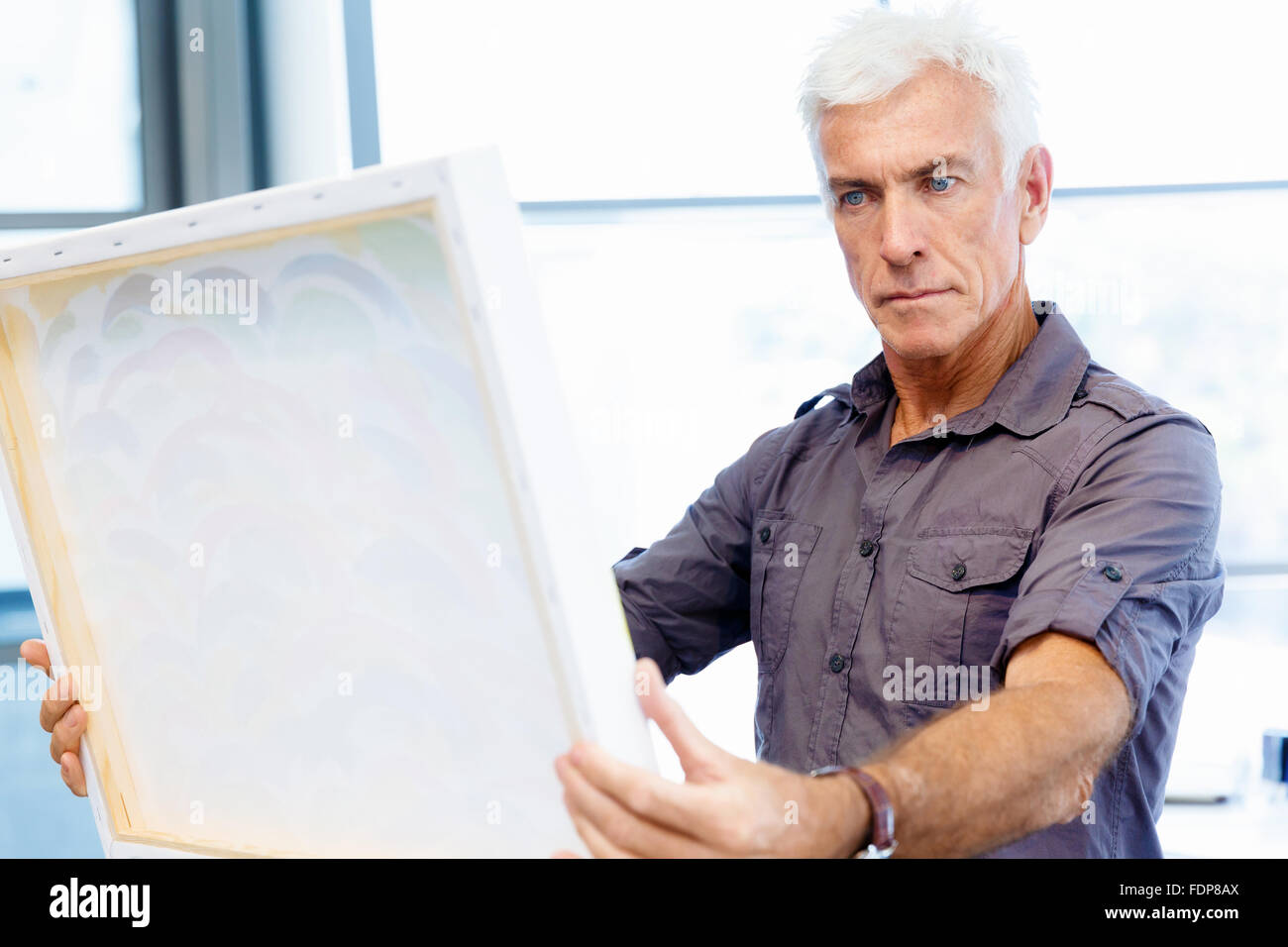 Man standing in a gallery and contemplating abstract artwork Stock ...