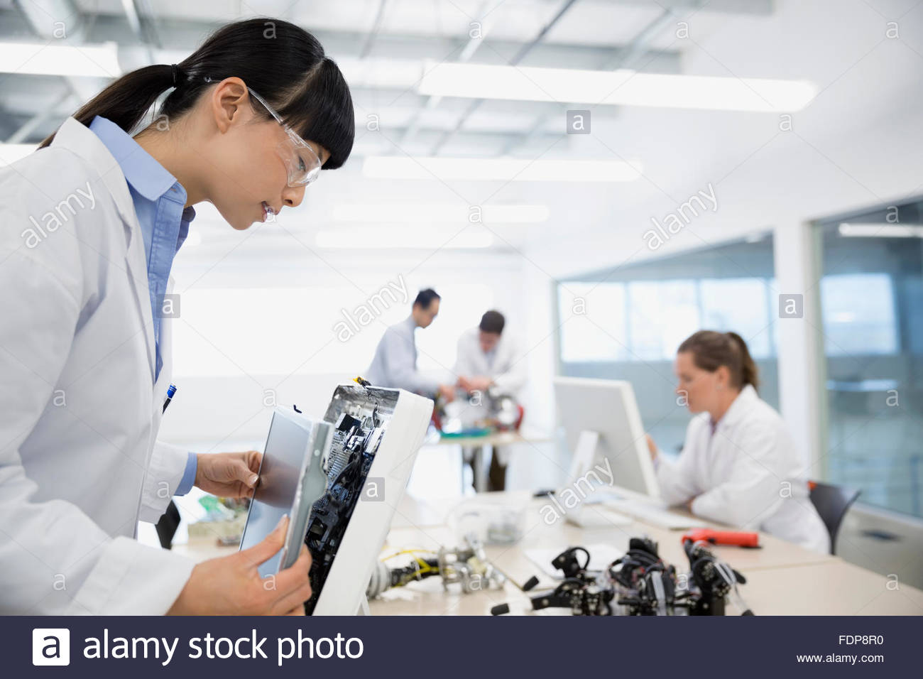 Engineer assembling computer in factory Stock Photo - Alamy