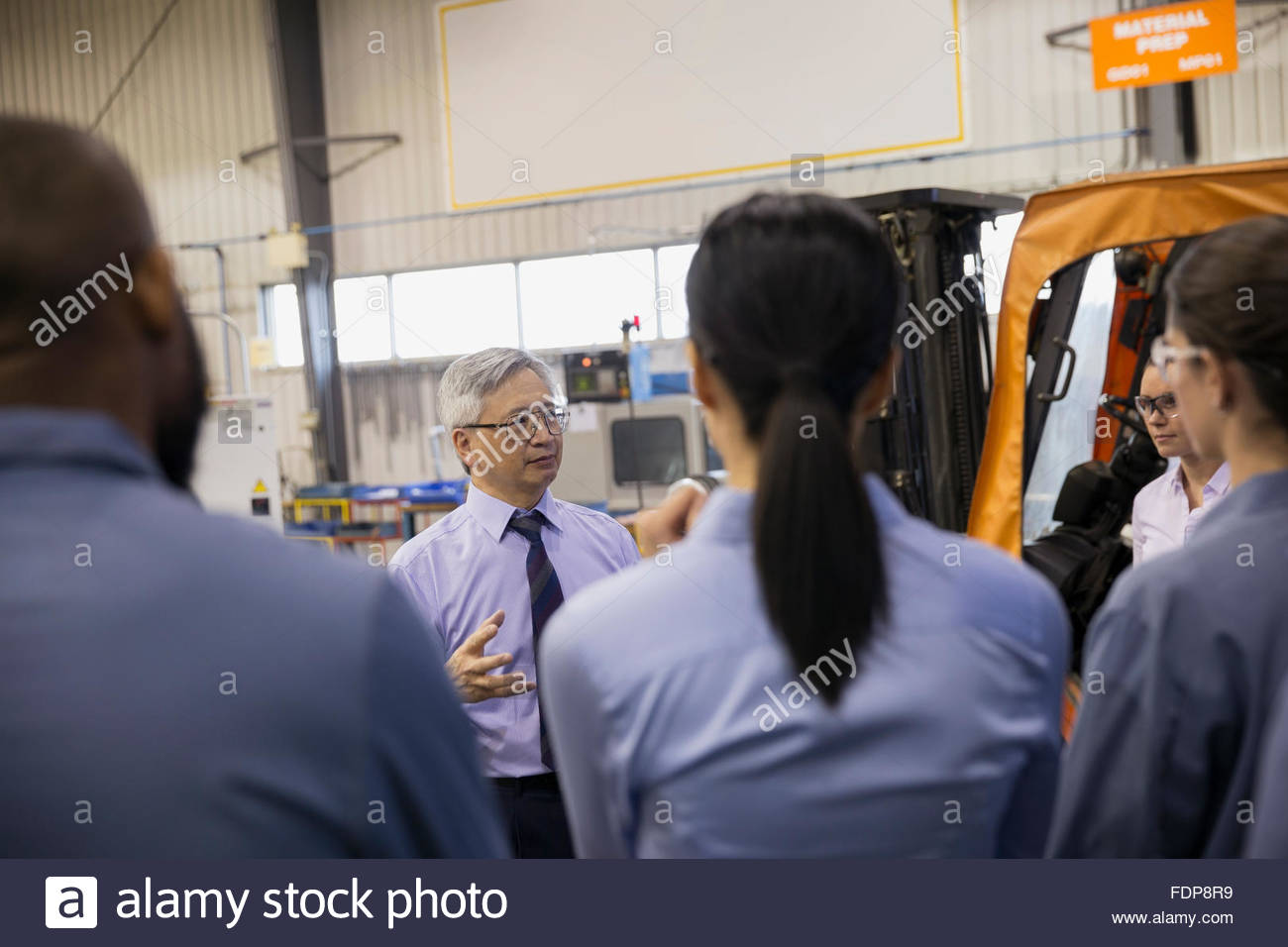Black man leading meeting group hi-res stock photography and images - Alamy