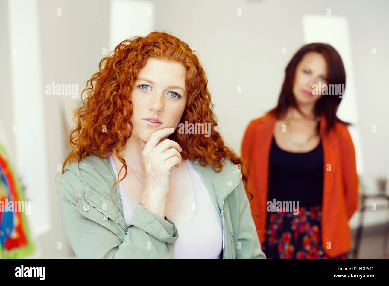 two young women in a gallery and contemplating abstract artwork Stock ...