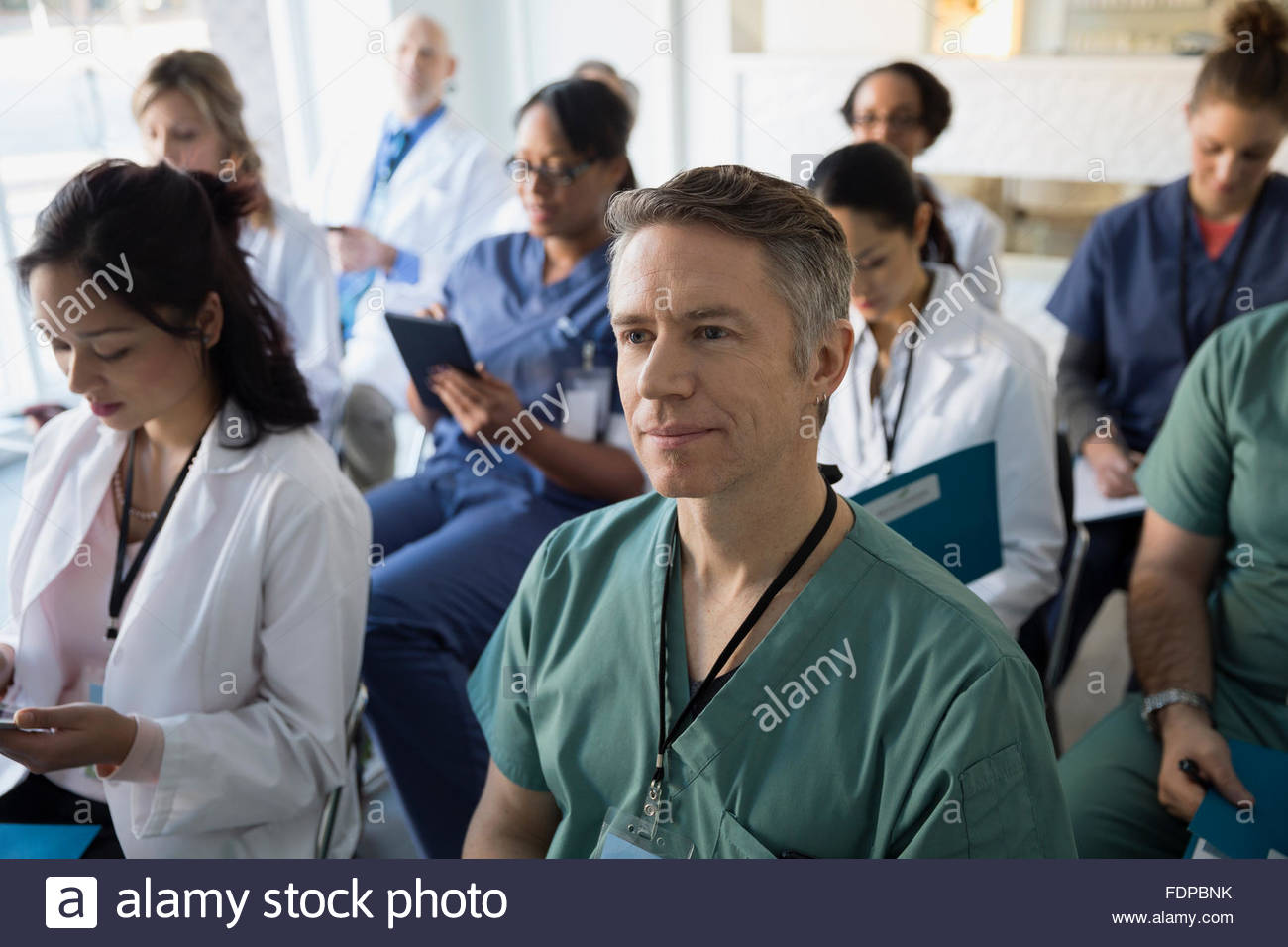Doctor listening in hi-res stock photography and images - Alamy