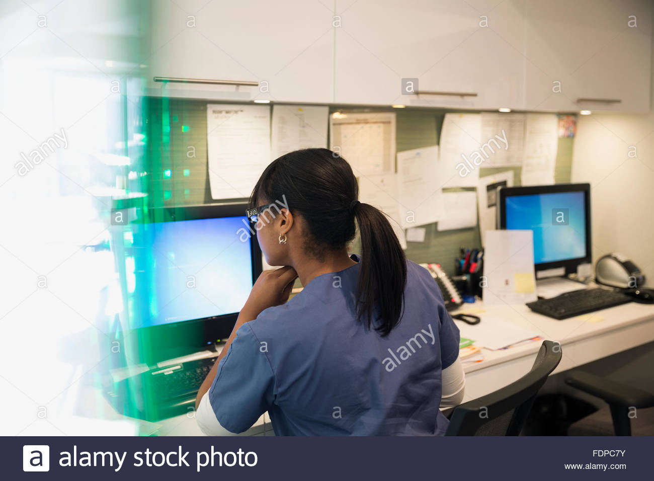 Young nurse on computer hi-res stock photography and images - Alamy