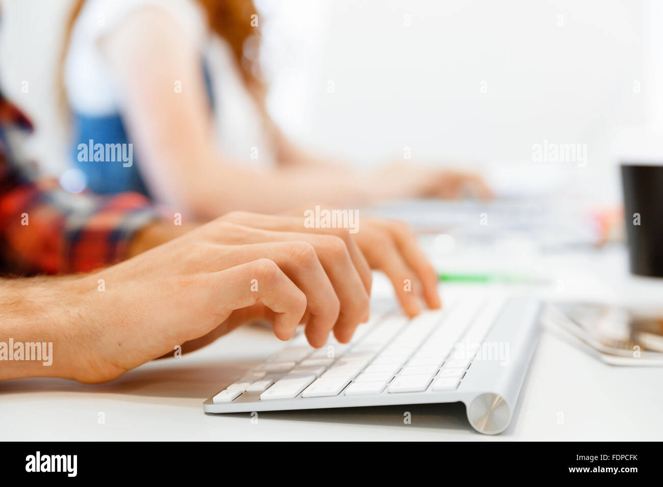 Hands of office worker typing on the keyboard Stock Photo - Alamy