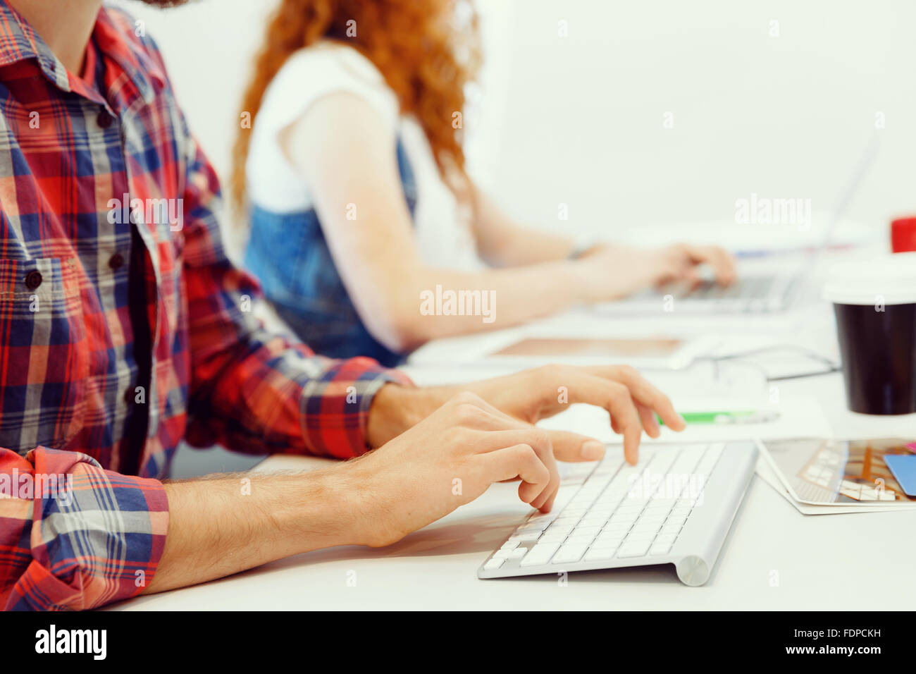Hands of office worker typing on the keyboard Stock Photo - Alamy