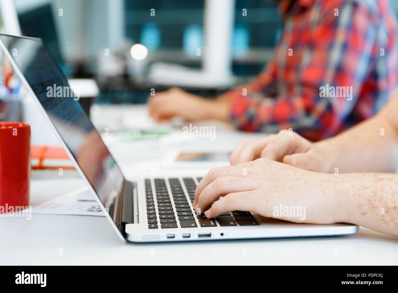 Hands of office worker typing on the keyboard Stock Photo - Alamy