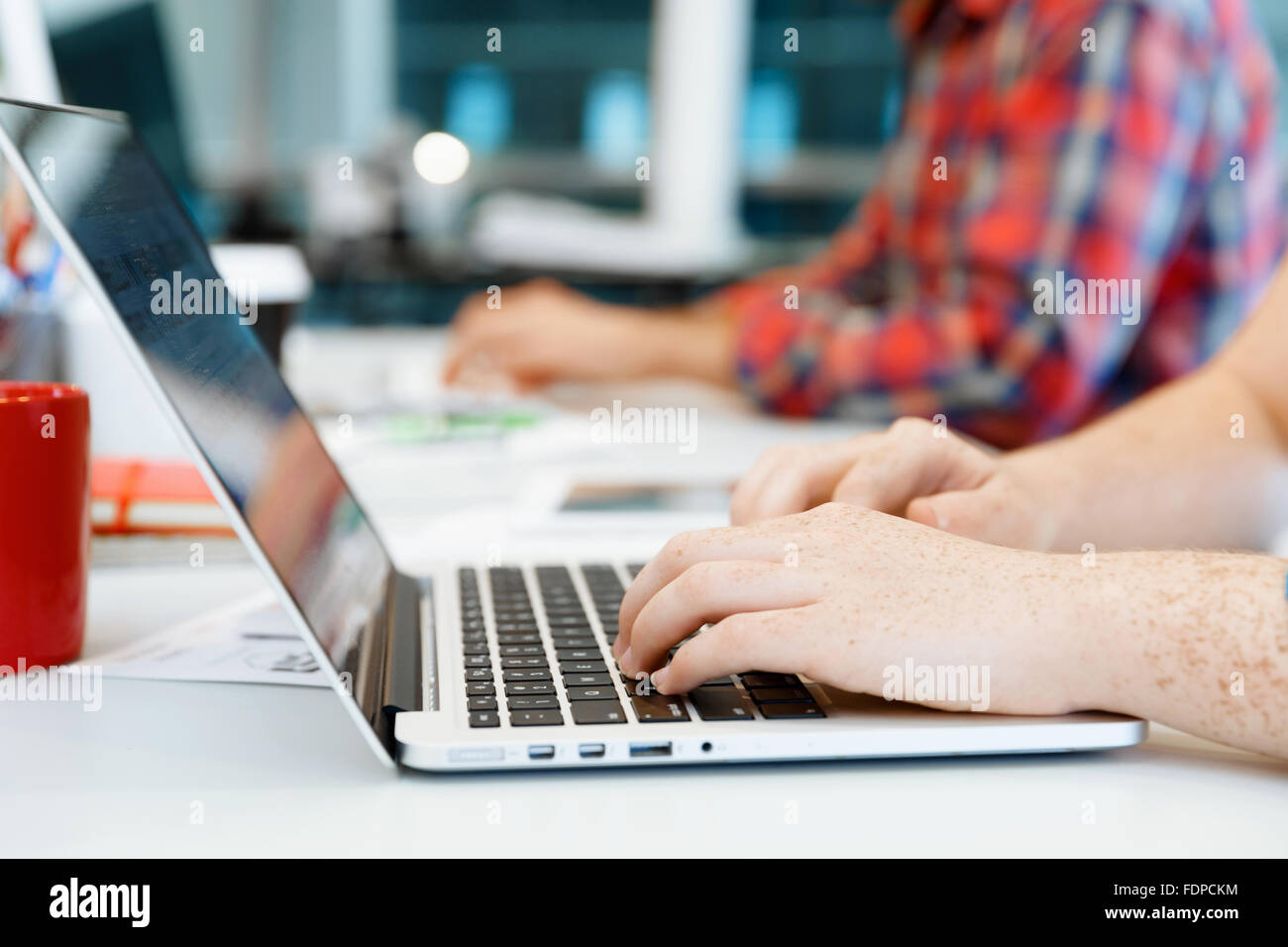 Hands of office worker typing on the keyboard Stock Photo - Alamy