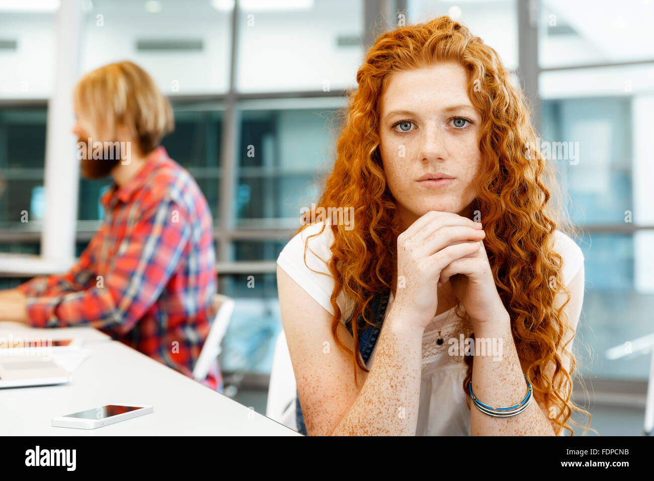 Young and pretty business woman working in office Stock Photo - Alamy