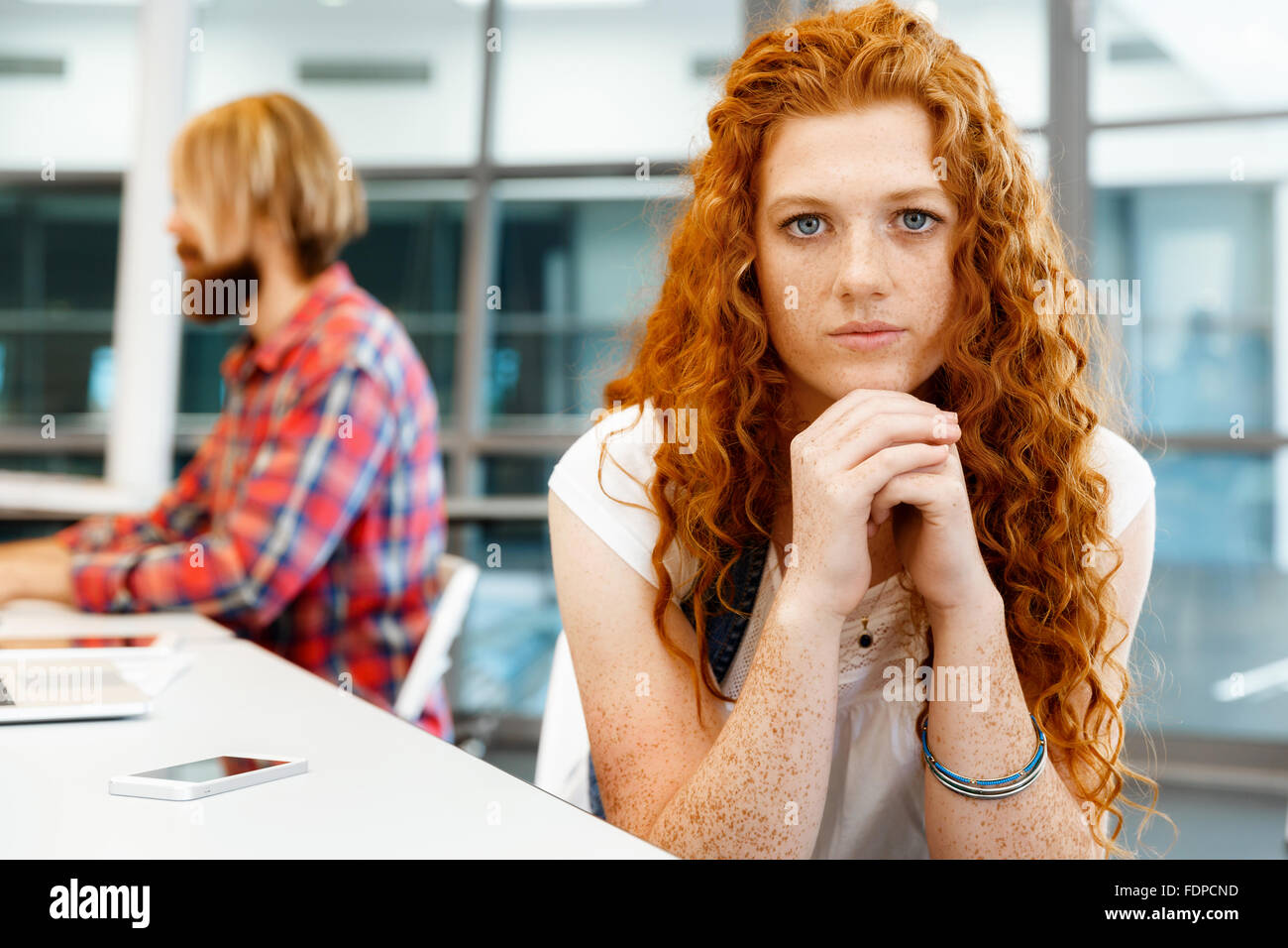 Young and pretty business woman working in office Stock Photo - Alamy