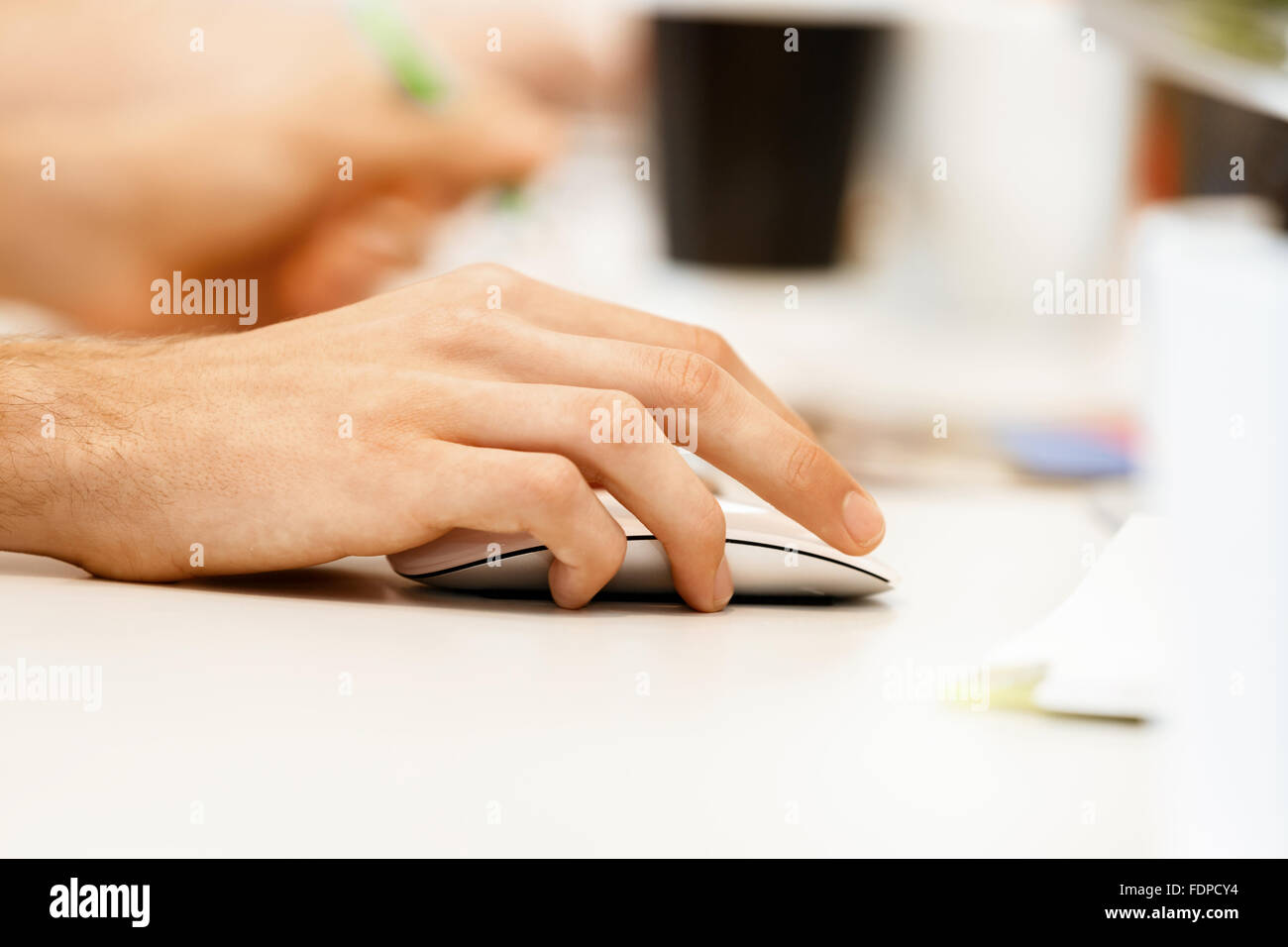 Hands of office worker holding computer mouse Stock Photo - Alamy
