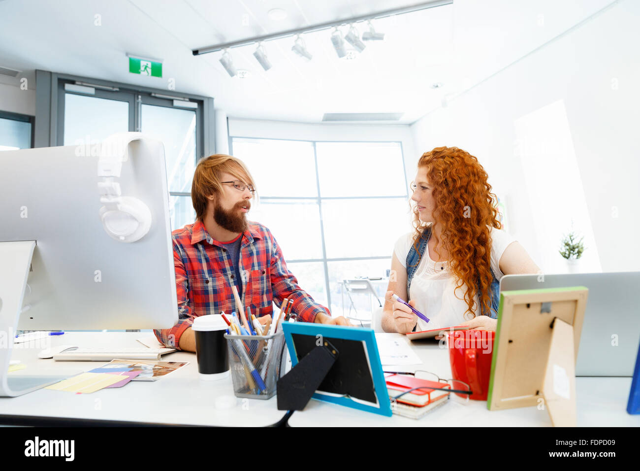 Business team working together in office Stock Photo - Alamy
