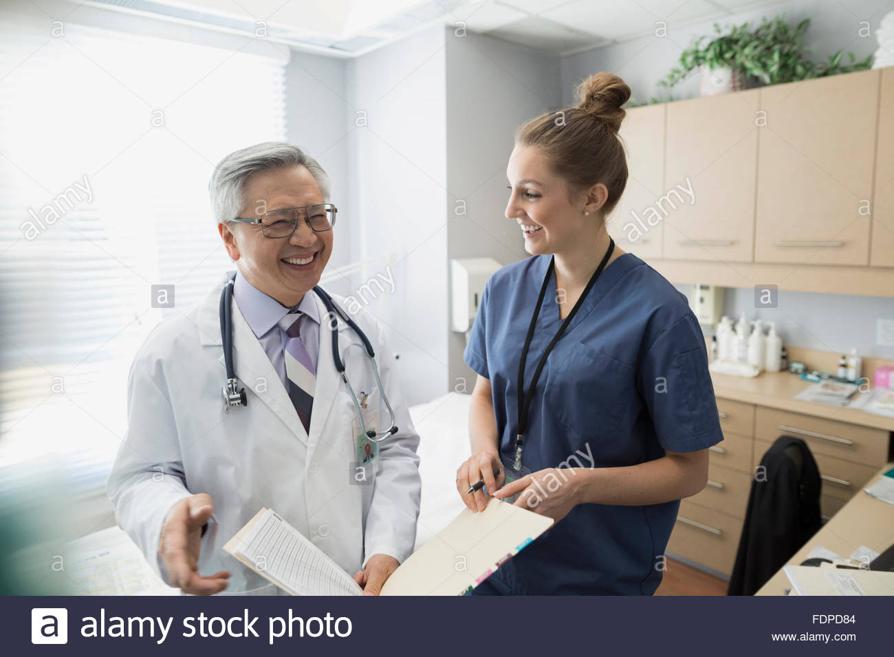 Doctor laughing hi-res stock photography and images - Alamy