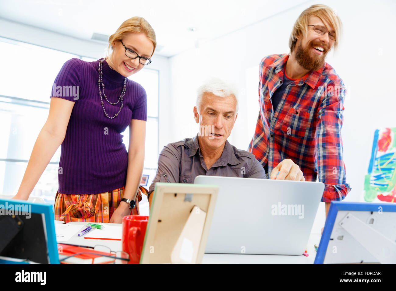 Business team working together in office Stock Photo - Alamy