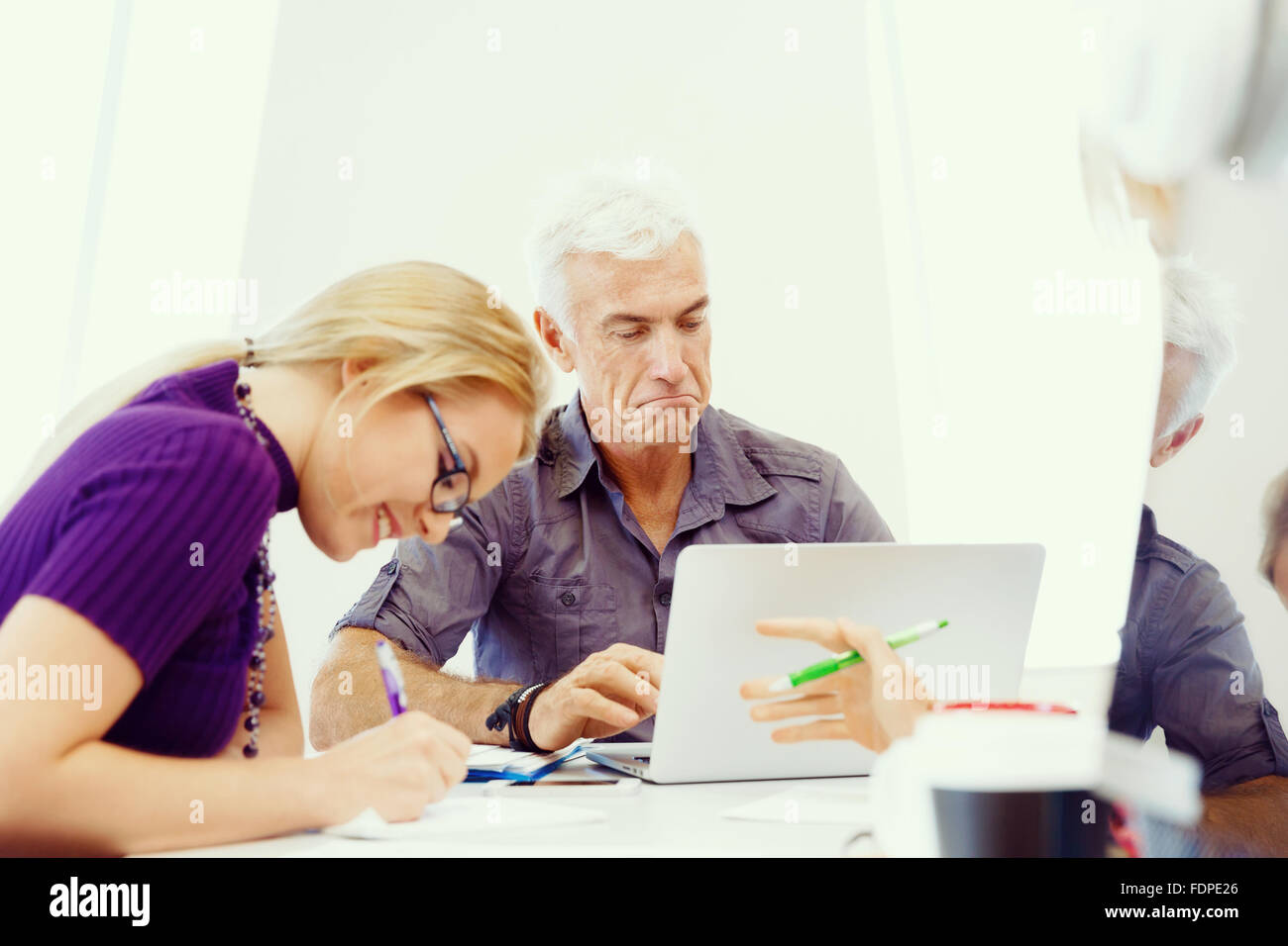 Business team working together in office Stock Photo - Alamy