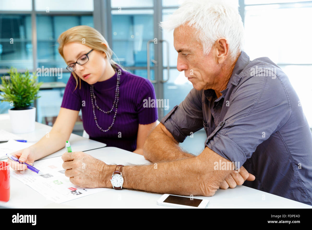 Business team working together in office Stock Photo - Alamy