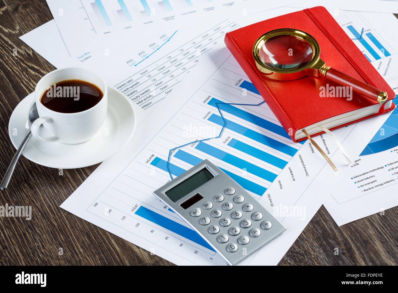 financial charts and graphs and a cup of coffee Stock Photo - Alamy