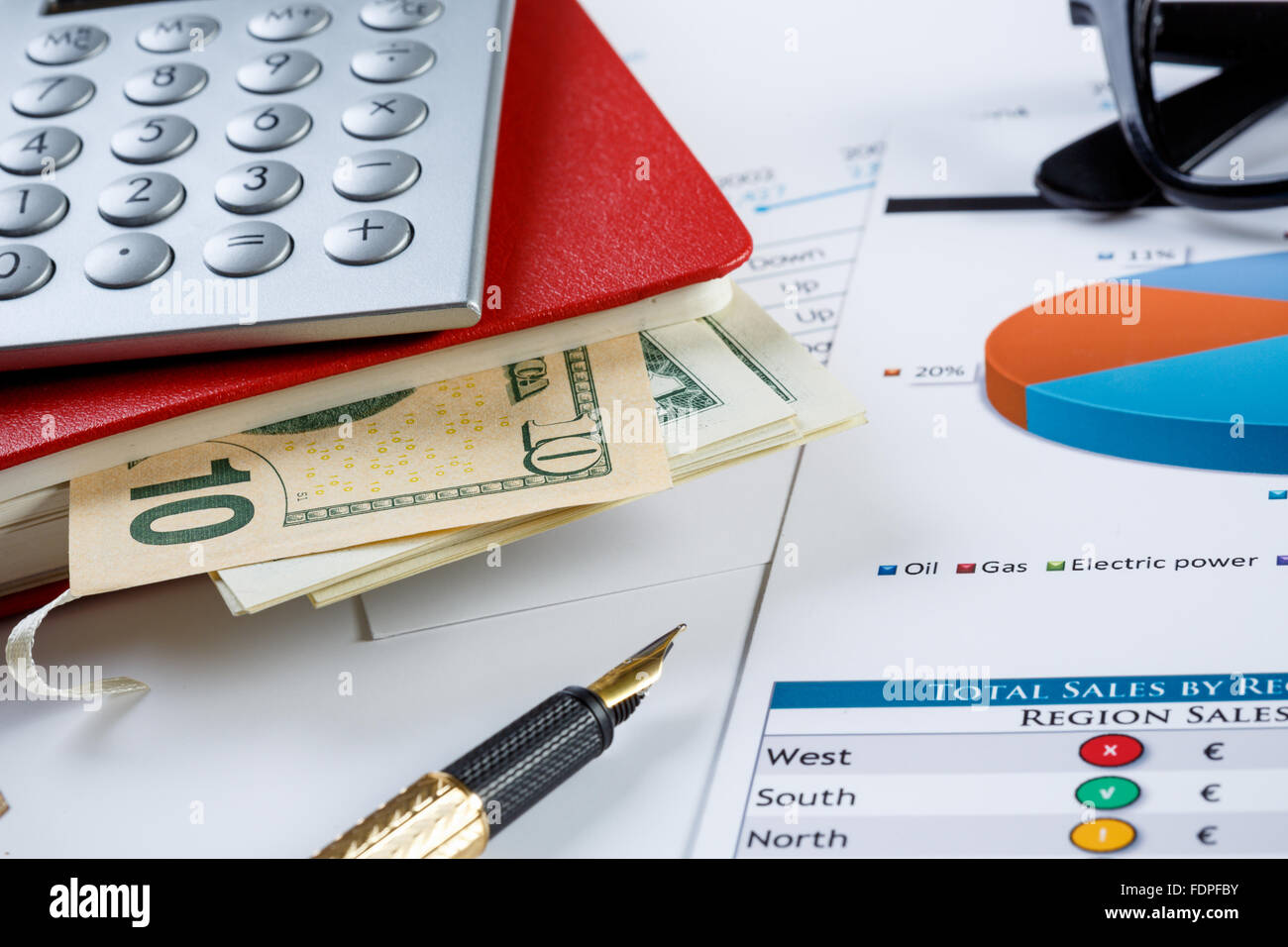 financial charts and graphs and a pen on the office table Stock Photo ...