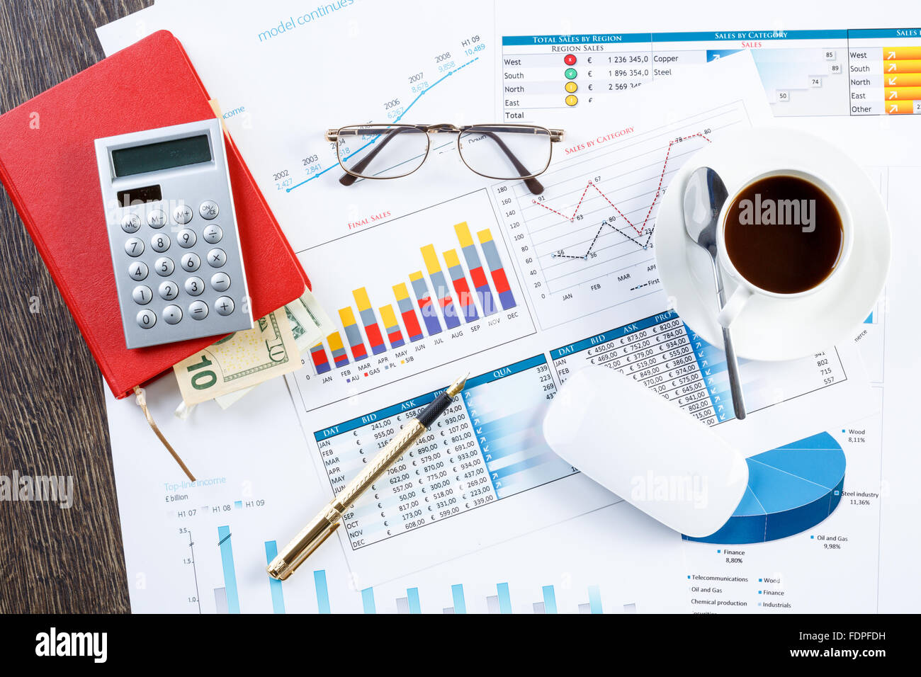 financial charts and graphs and a pen on the office table Stock Photo ...