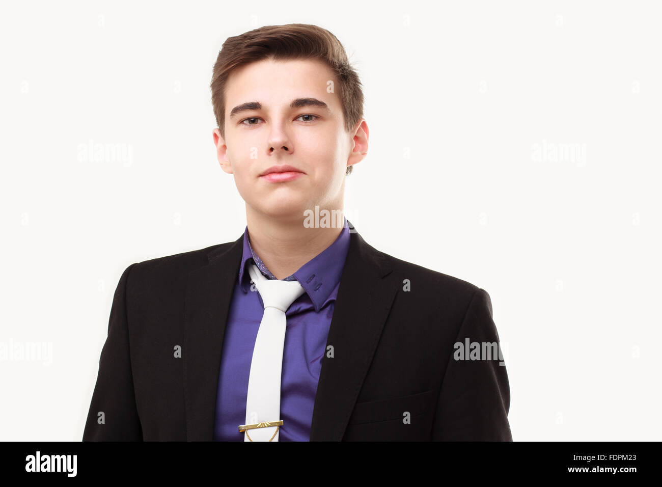 Close-up portrait of young business man wearing suit and tie isolated ...