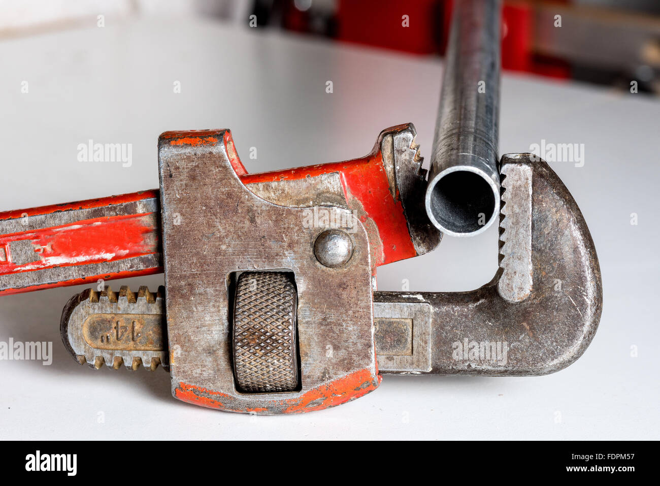 Pipe in the jaws of a wrench for work Stock Photo - Alamy