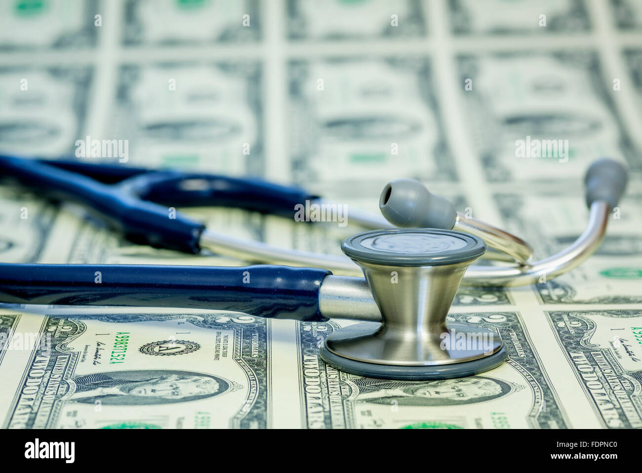 Doctors Stethoscope on money cash Stock Photo - Alamy