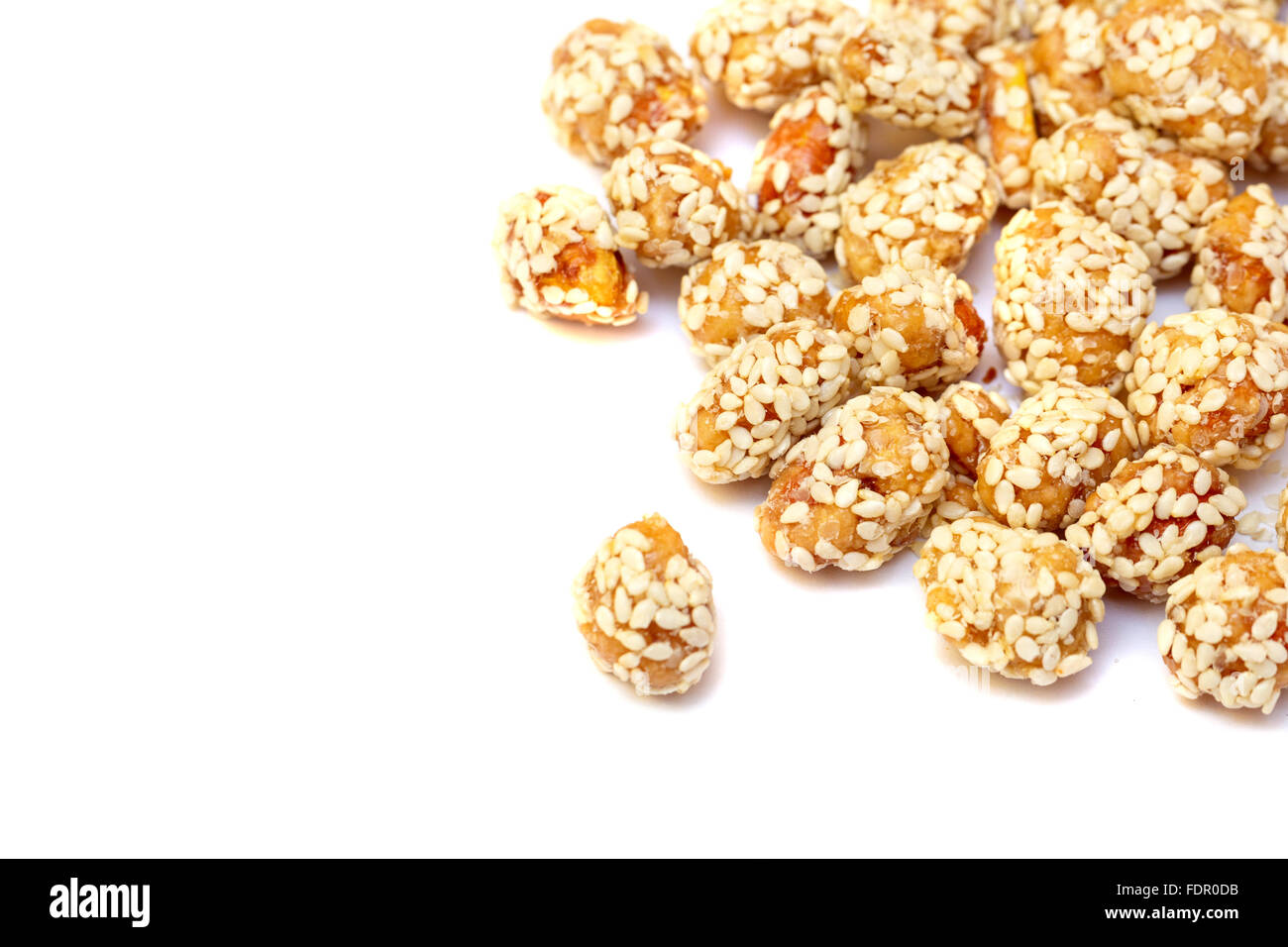 Nuts in honey and sesame. Roasted peanuts, breaded. Sugary snacks and ...
