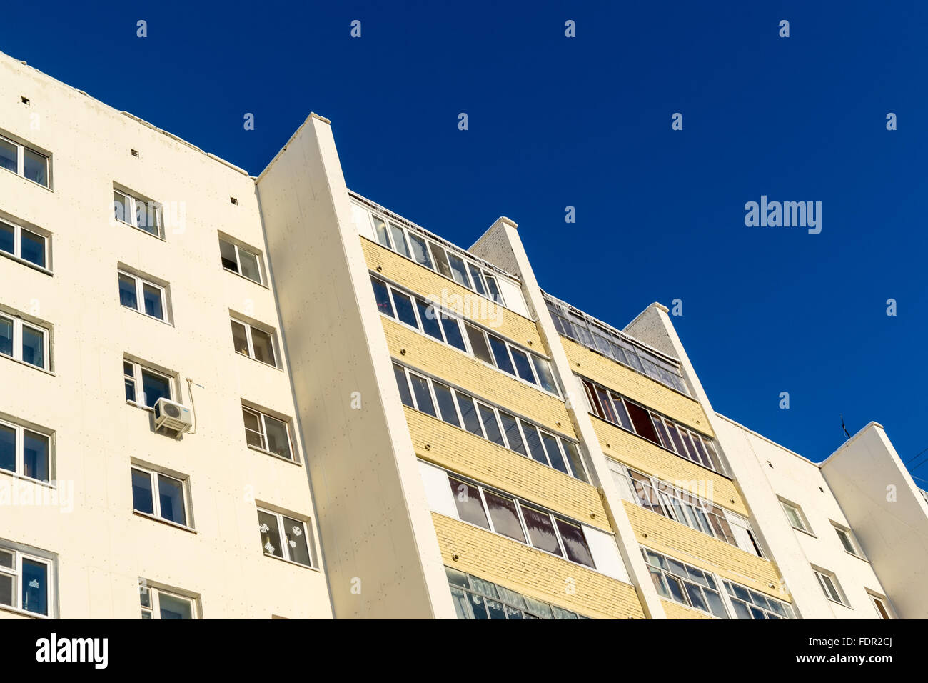 Architecture abstract of a white apartment building block set against a ...