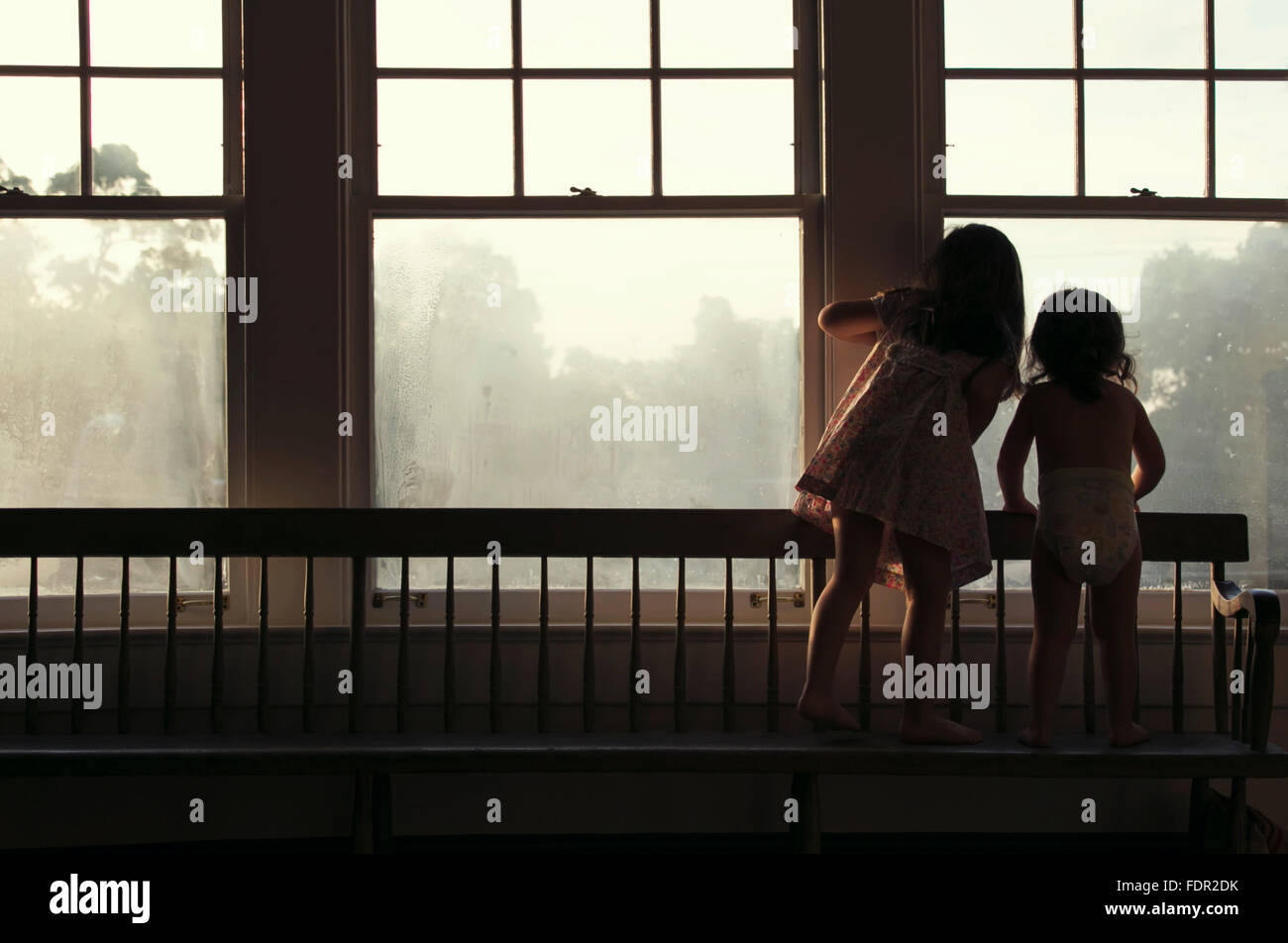 Two girls sisters on bench hi-res stock photography and images - Alamy