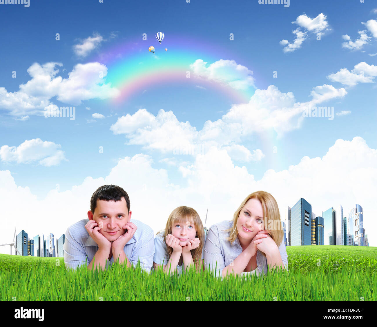 Young happy family outdoor on the ground Stock Photo - Alamy