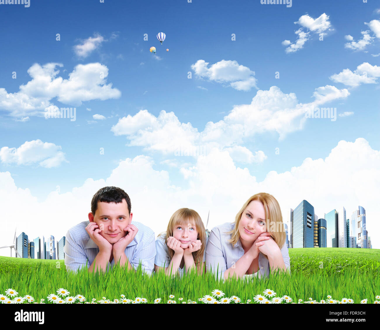Young happy family outdoor on the ground Stock Photo - Alamy