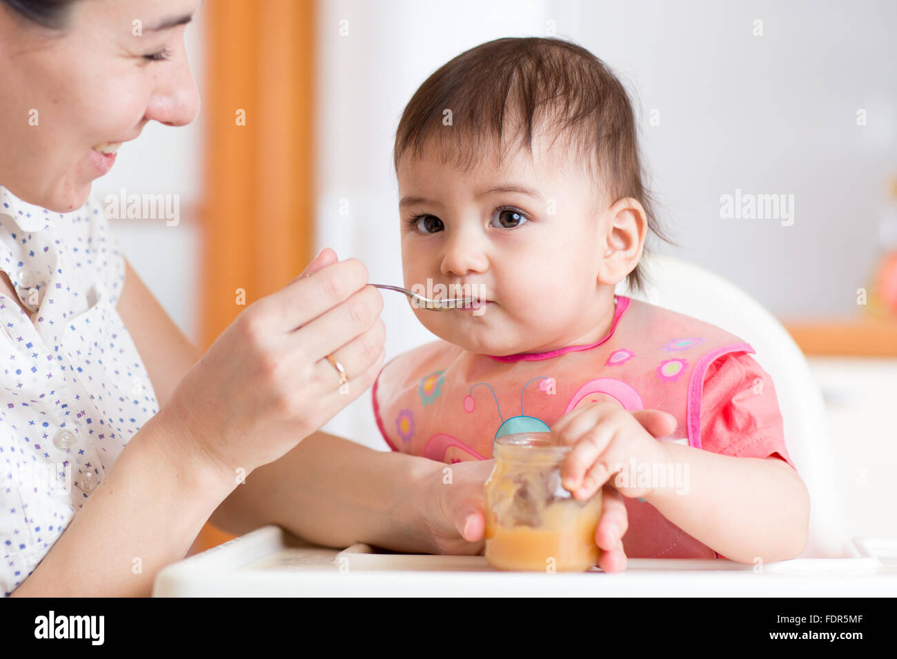 Infant toddler family eating table hi-res stock photography and images ...