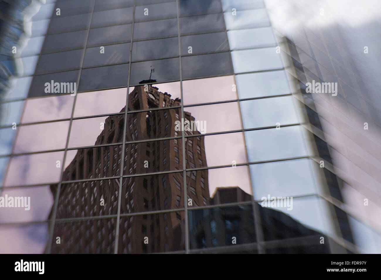 Reflections of clouds on glass facade of modern building hi-res stock ...