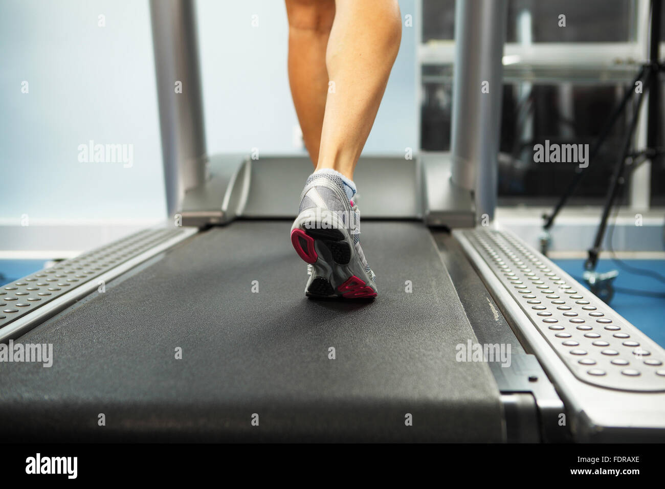 Image of female foot running on treadmill Stock Photo - Alamy