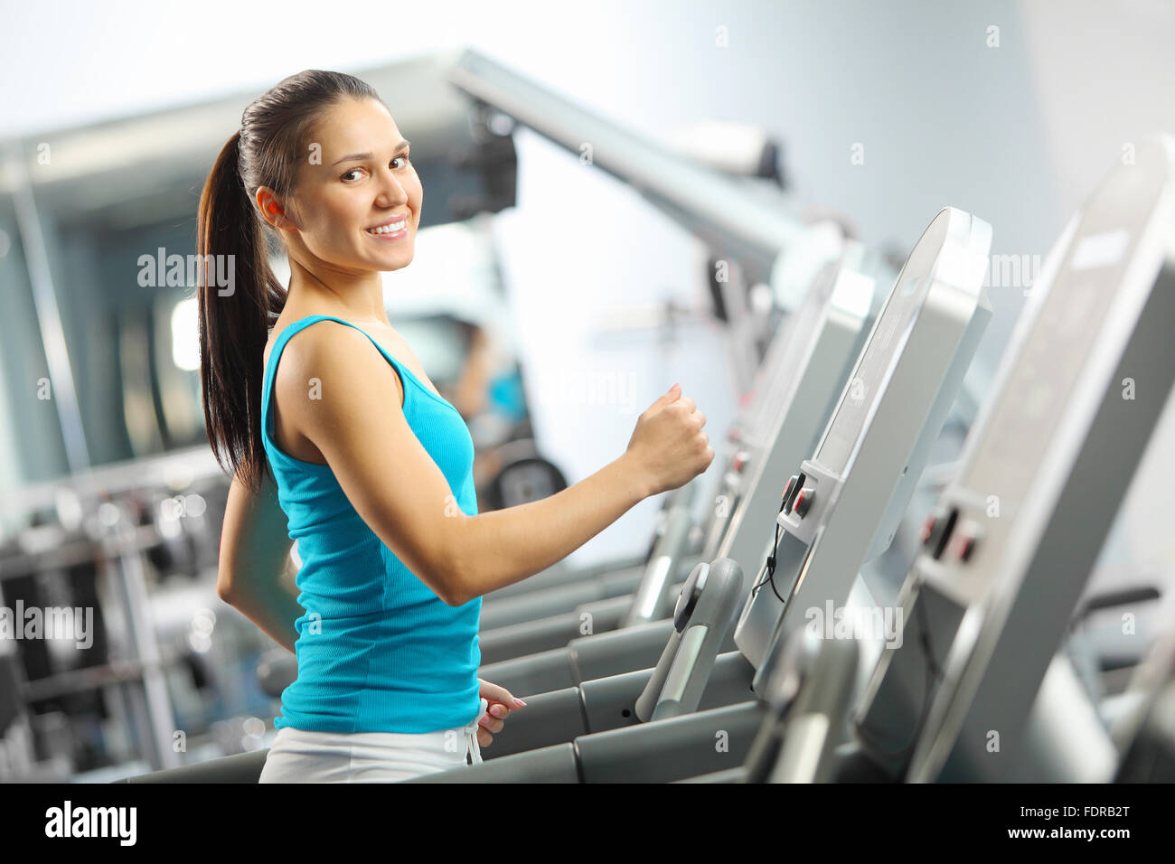 Image of fitness girl running on treadmill Stock Photo - Alamy