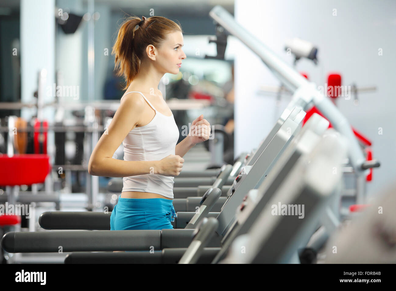 Image of fitness girl running on treadmill Stock Photo - Alamy