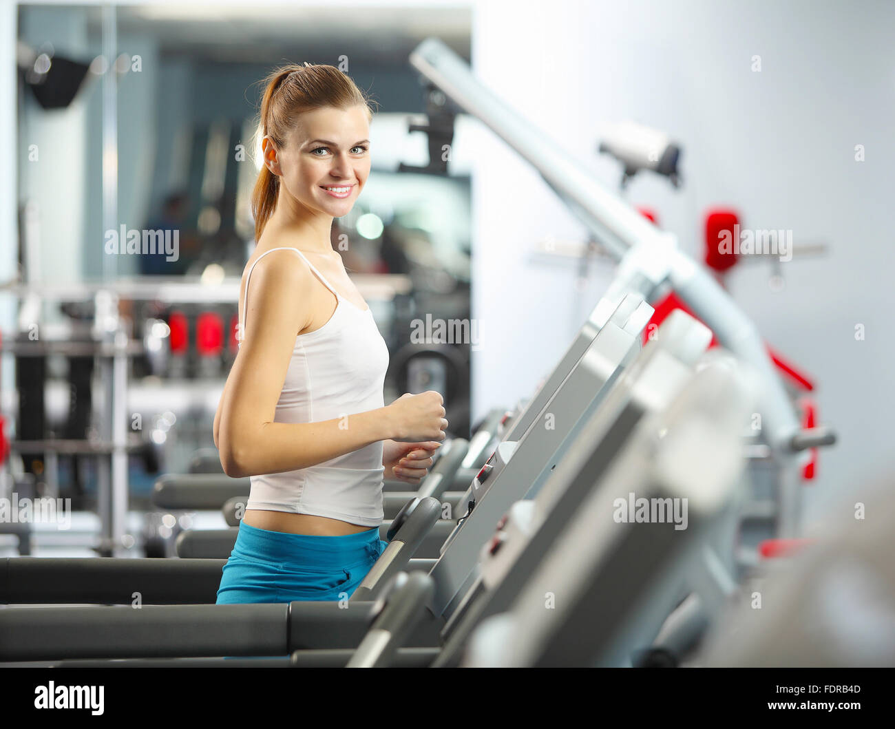 Image of fitness girl running on treadmill Stock Photo - Alamy