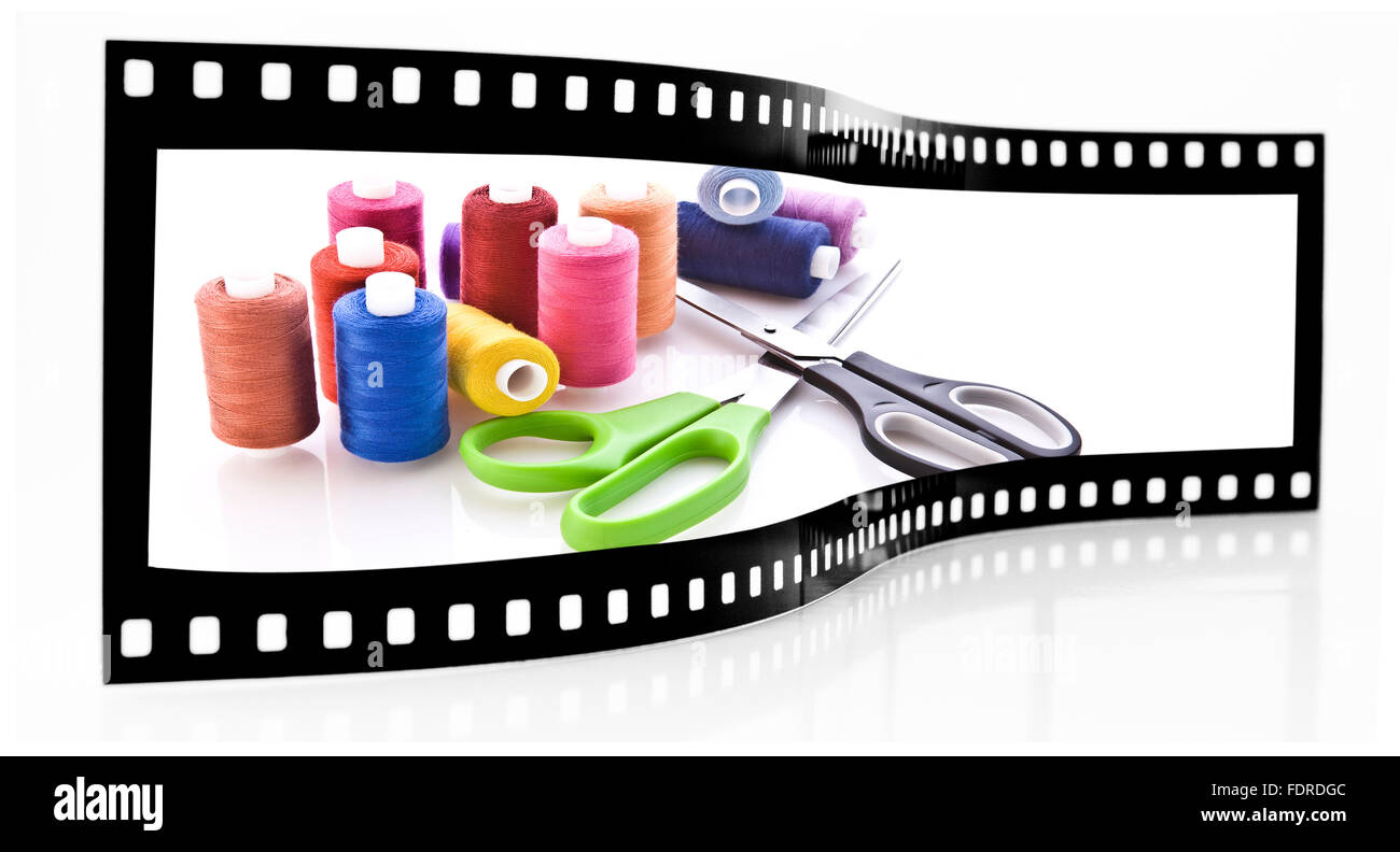 Sewing film strip on a white background Stock Photo - Alamy