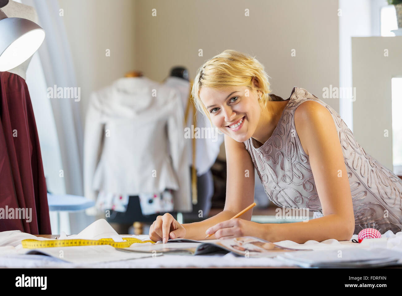 Female tailor making patterns hi-res stock photography and images - Alamy