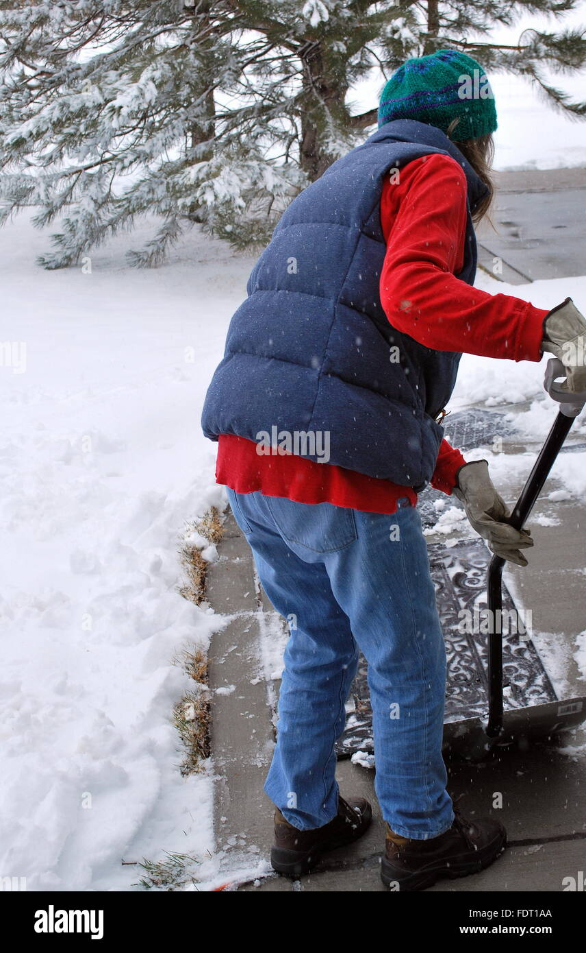 Woman Shoveling Snow Stock Photos & Woman Shoveling Snow Stock Images ...