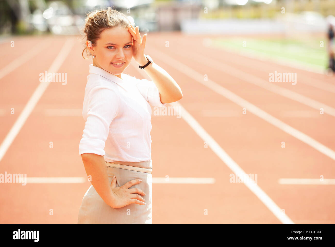 Businesswoman sport manager and executive at athletic stadium and race ...