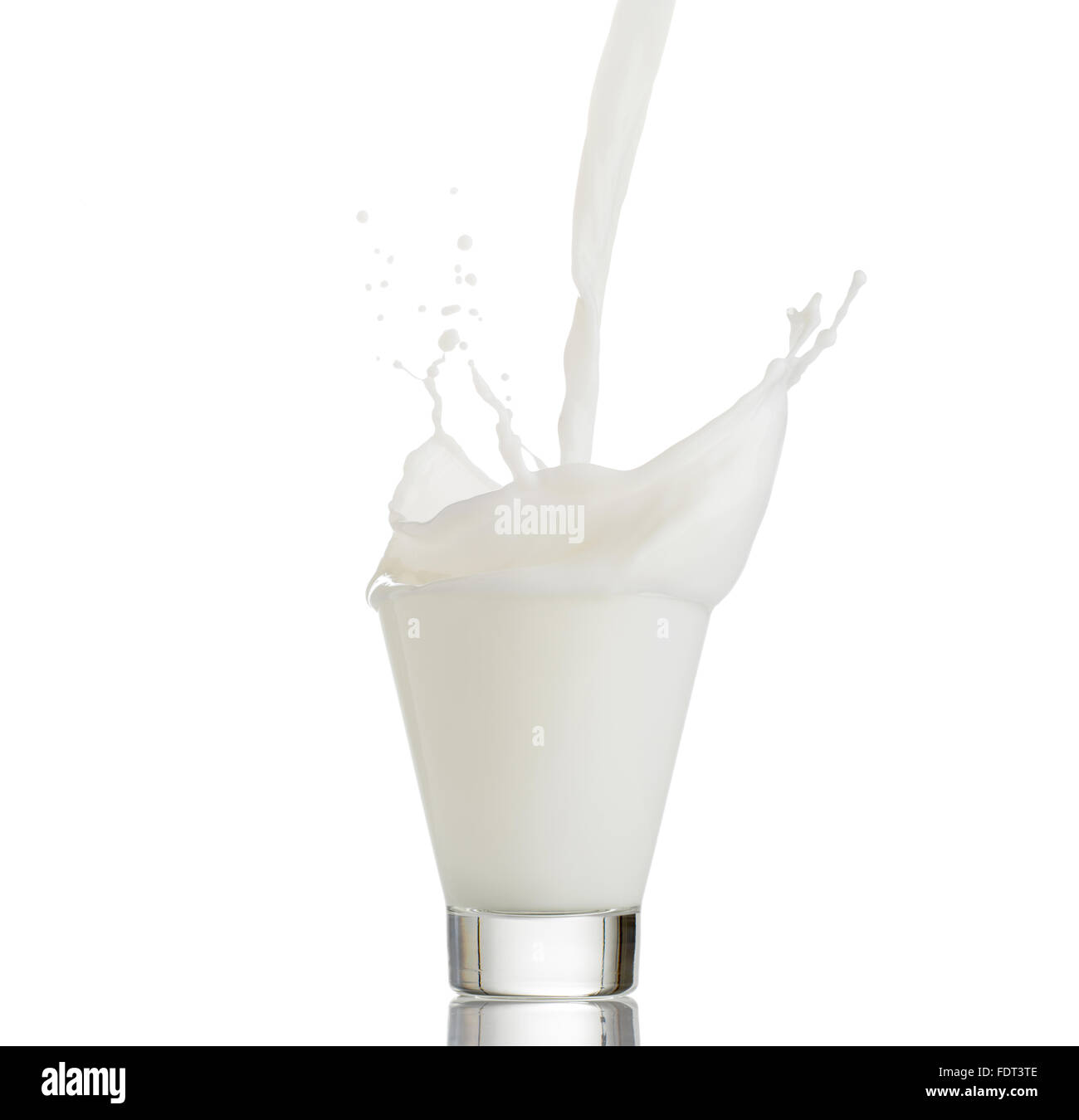 glass of splashing milk isolated on white background Stock Photo - Alamy