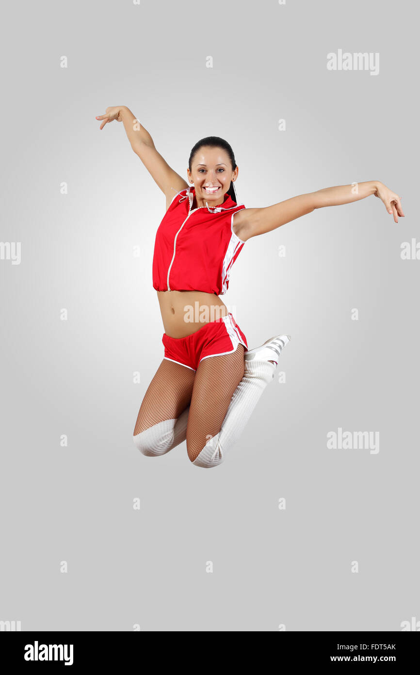 Young female dancer jumping against white background Stock Photo - Alamy