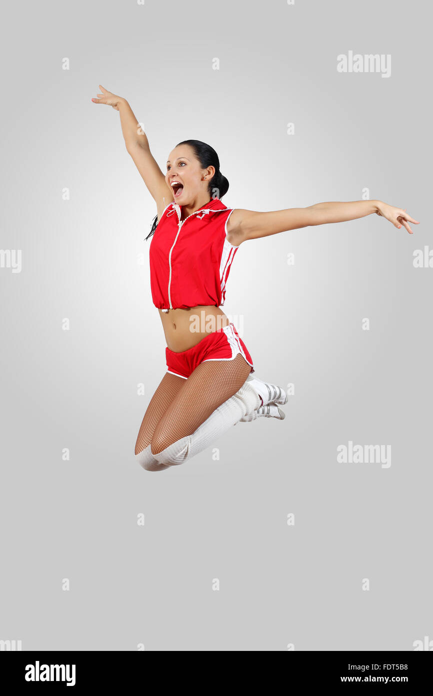 Young female dancer jumping against white background Stock Photo - Alamy