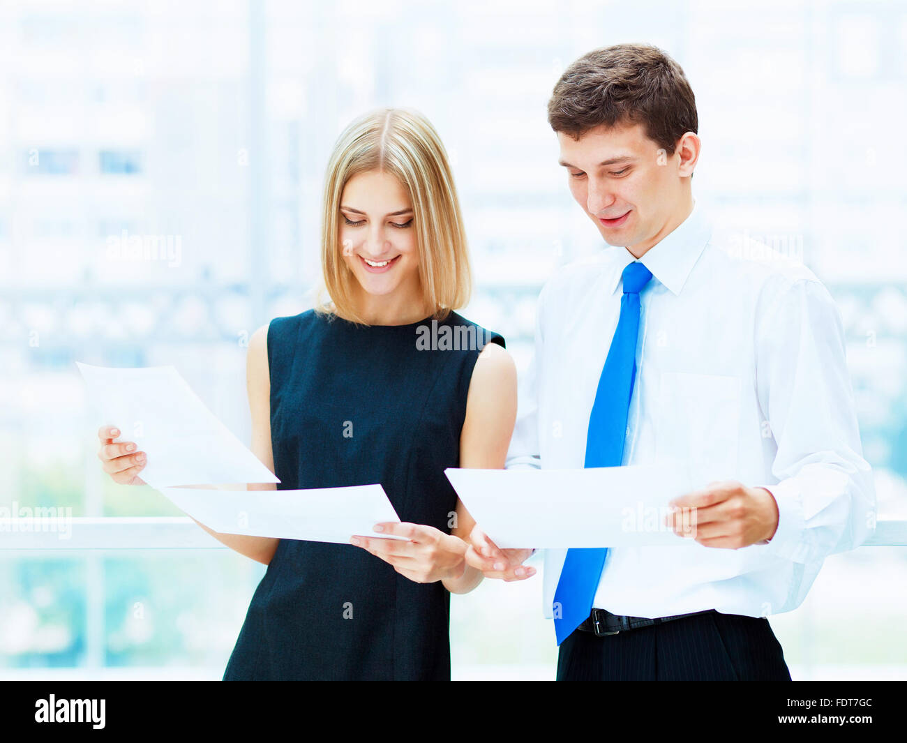 Two young business collegue working together in office Stock Photo - Alamy