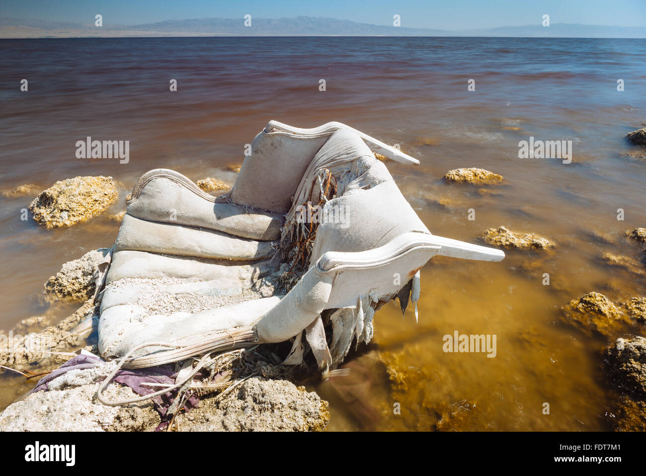A discarded chair on the western shore of the Salton Sea, California ...