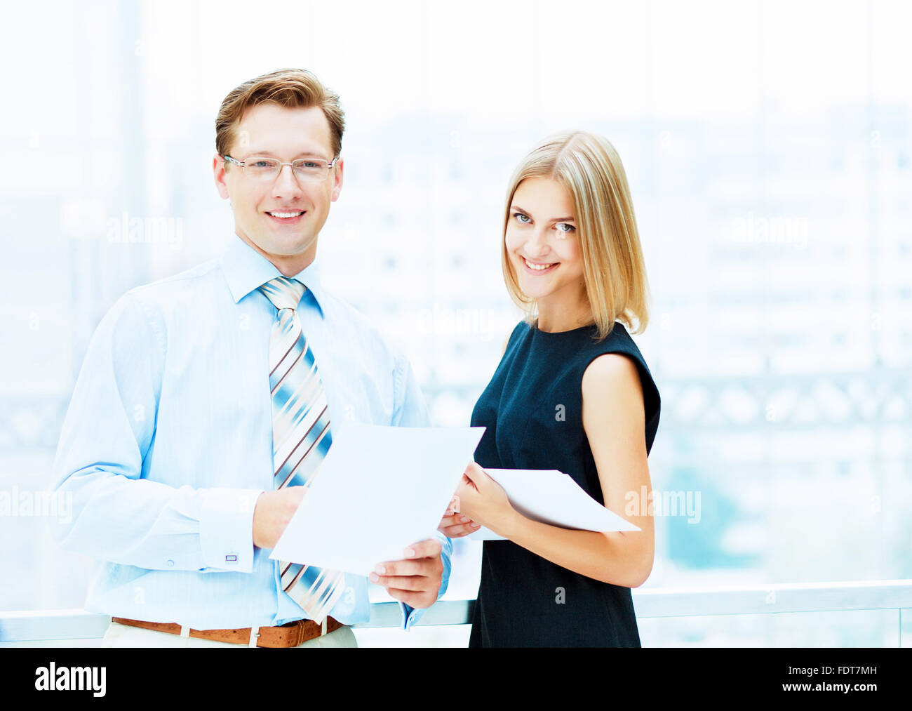 Two young business collegue working together in office Stock Photo - Alamy