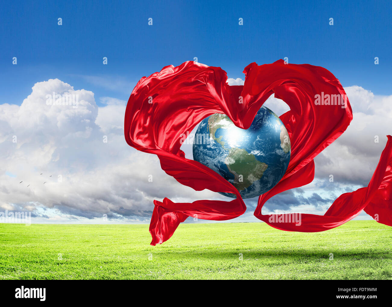 World within the heart symbol on blue sky background.Elements of this ...